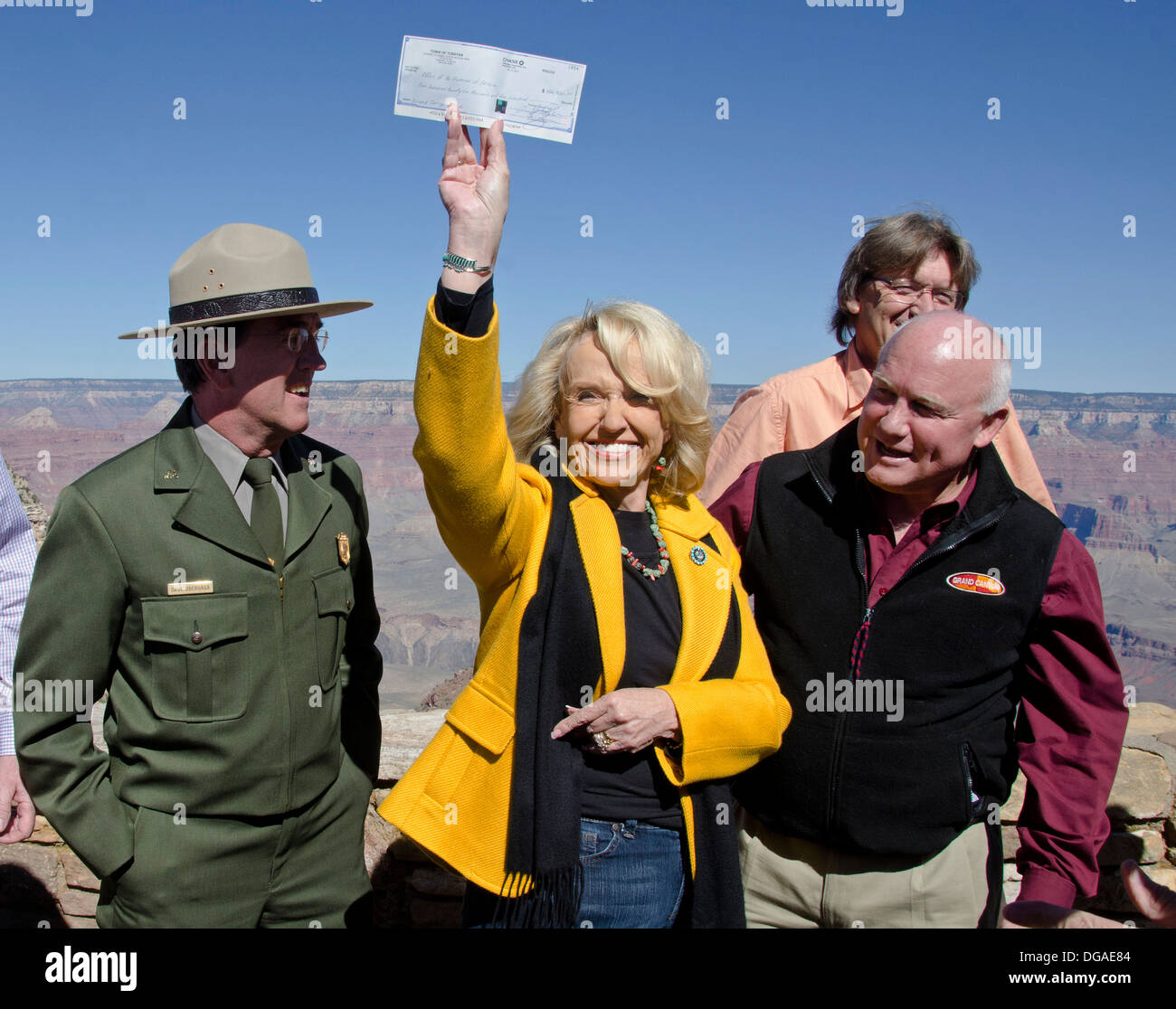 Arizona Governor Jan Brewer hold up the check for $426,500 from her ...