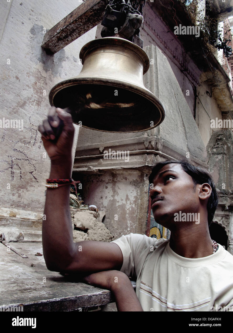 Man ringing temple bell hi-res stock photography and images - Alamy