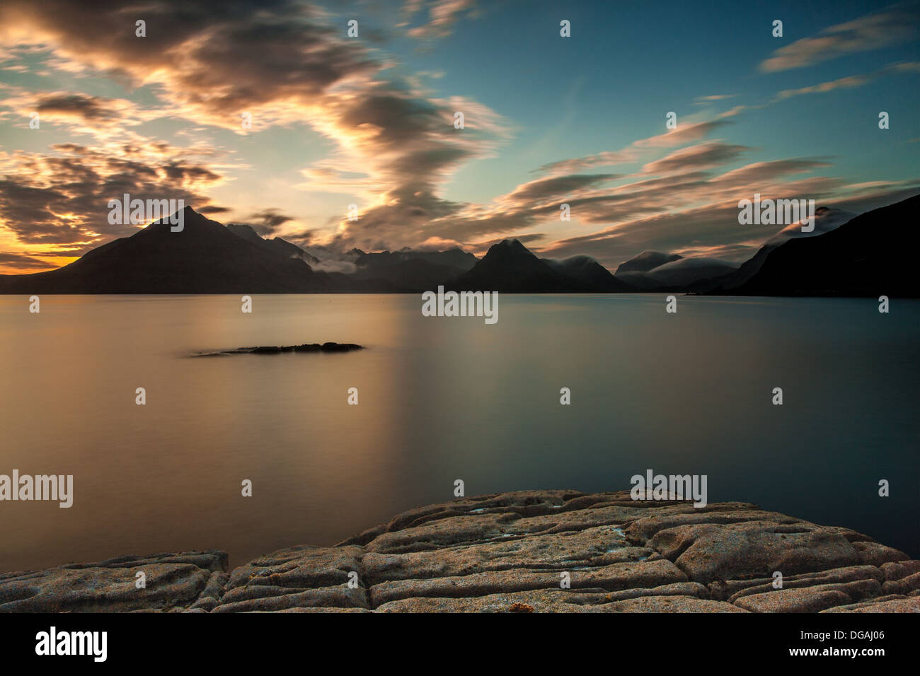 A breathtaking sunset over the Isle of Skye, showcasing the rich colors ...