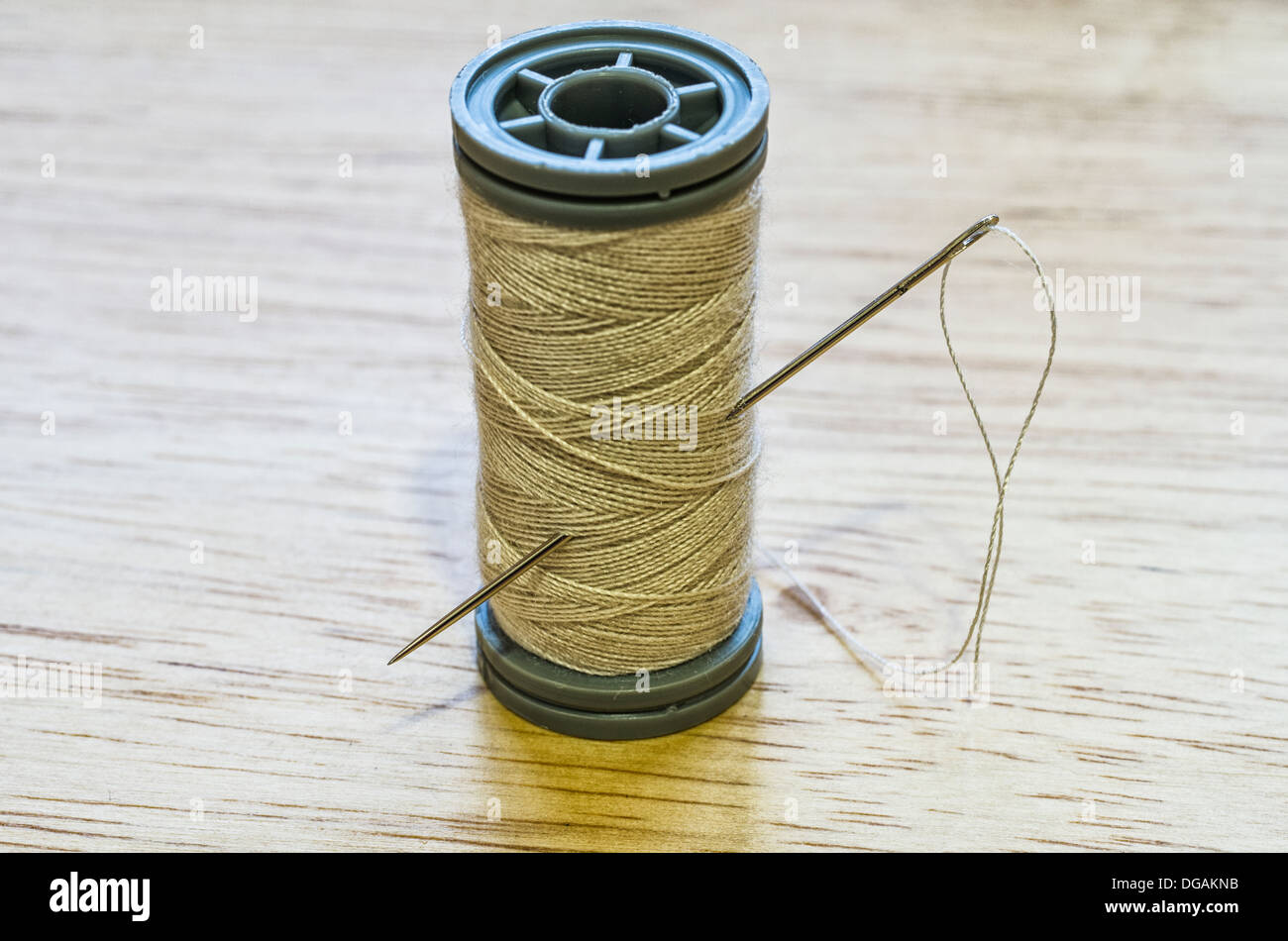Thread and needle for sewing Stock Photo - Alamy