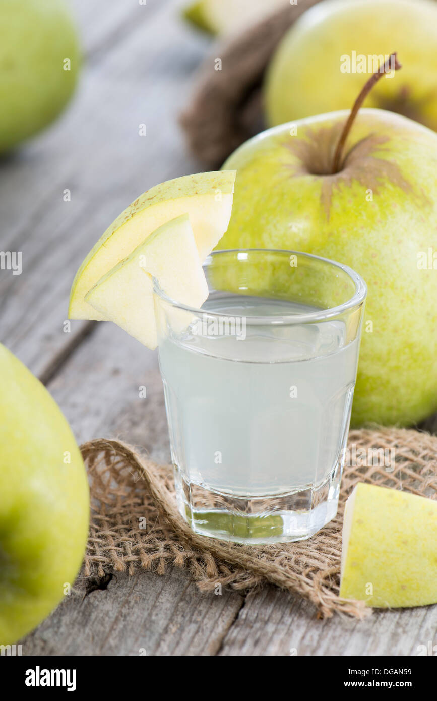 Shots of Apple Liqueur on vintage background Stock Photo - Alamy