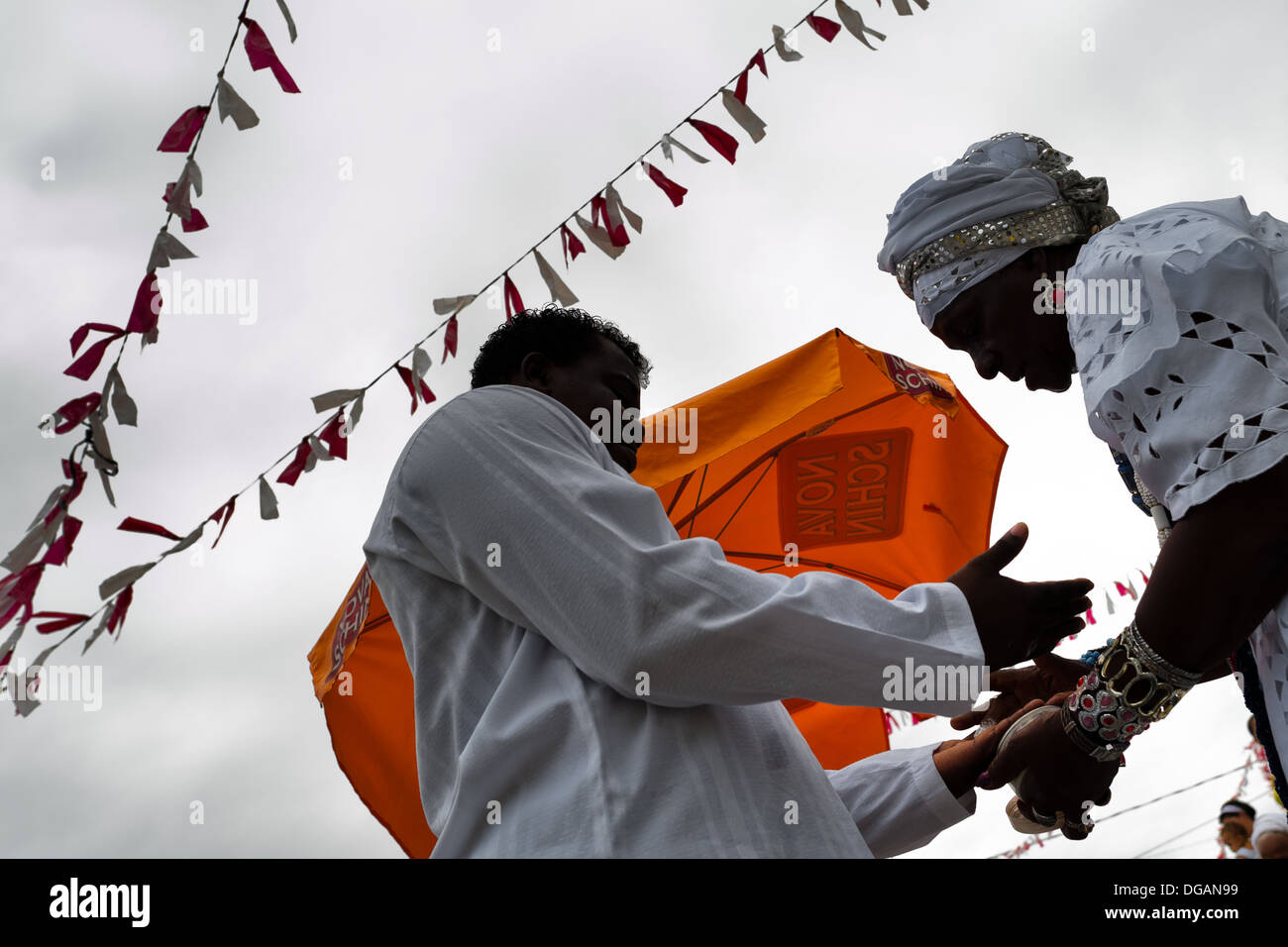 A Baiana woman performs the Afro-Brazilian spiritual cleansing ritual ...