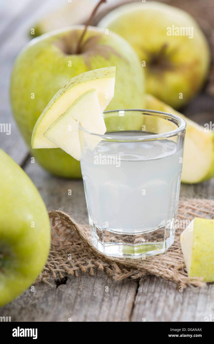 Apple Liqueur in small glasses with fruits Stock Photo - Alamy