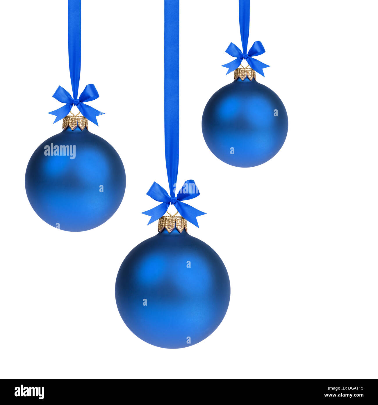 composition from three blue christmas balls hanging on ribbon, white ...