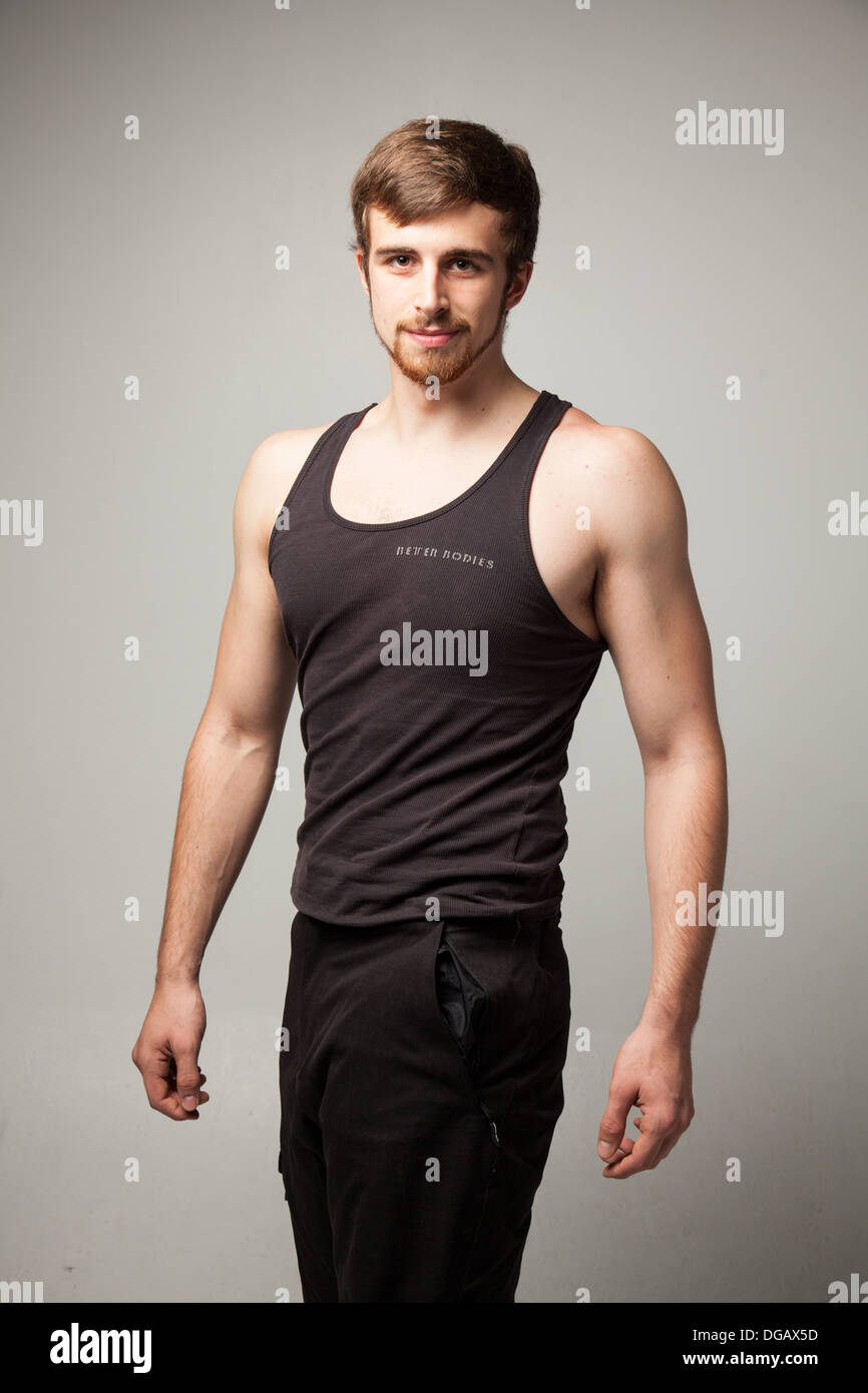 Athletic young male model in T-shirt Stock Photo - Alamy