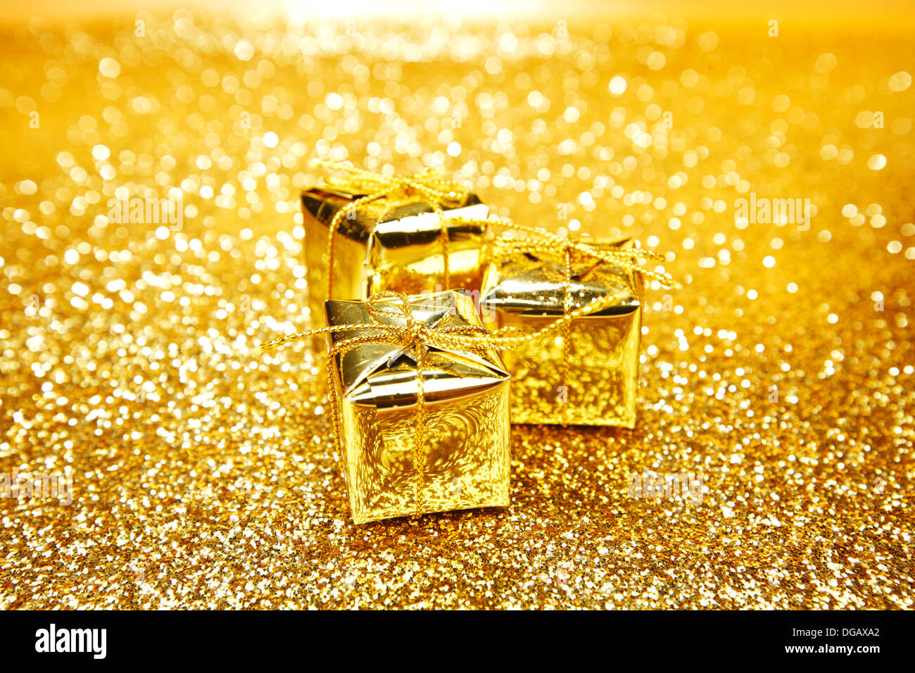 Golden boxes with christmas gifts on shiny glitter background Stock ...
