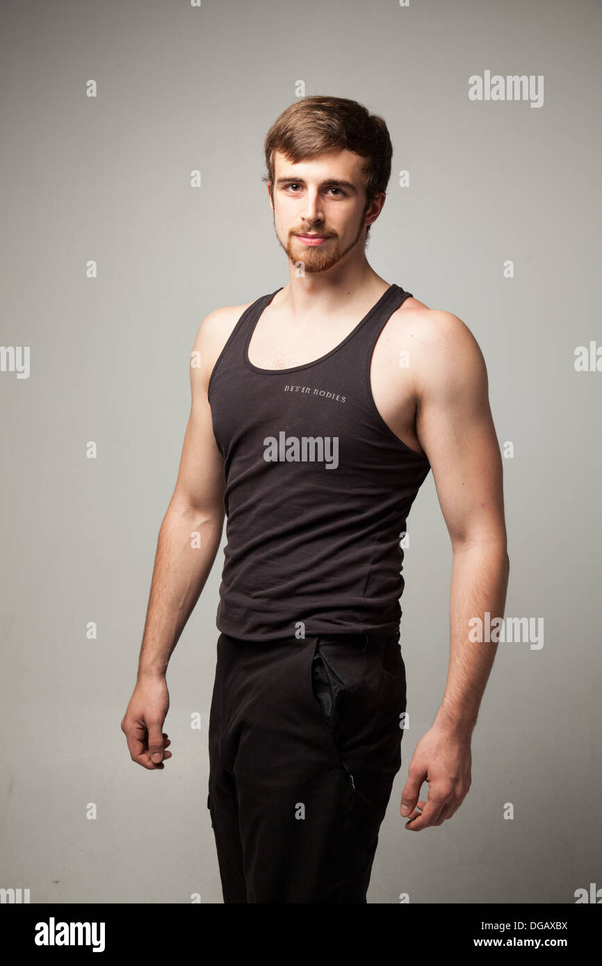 Athletic young male model in T-shirt Stock Photo - Alamy