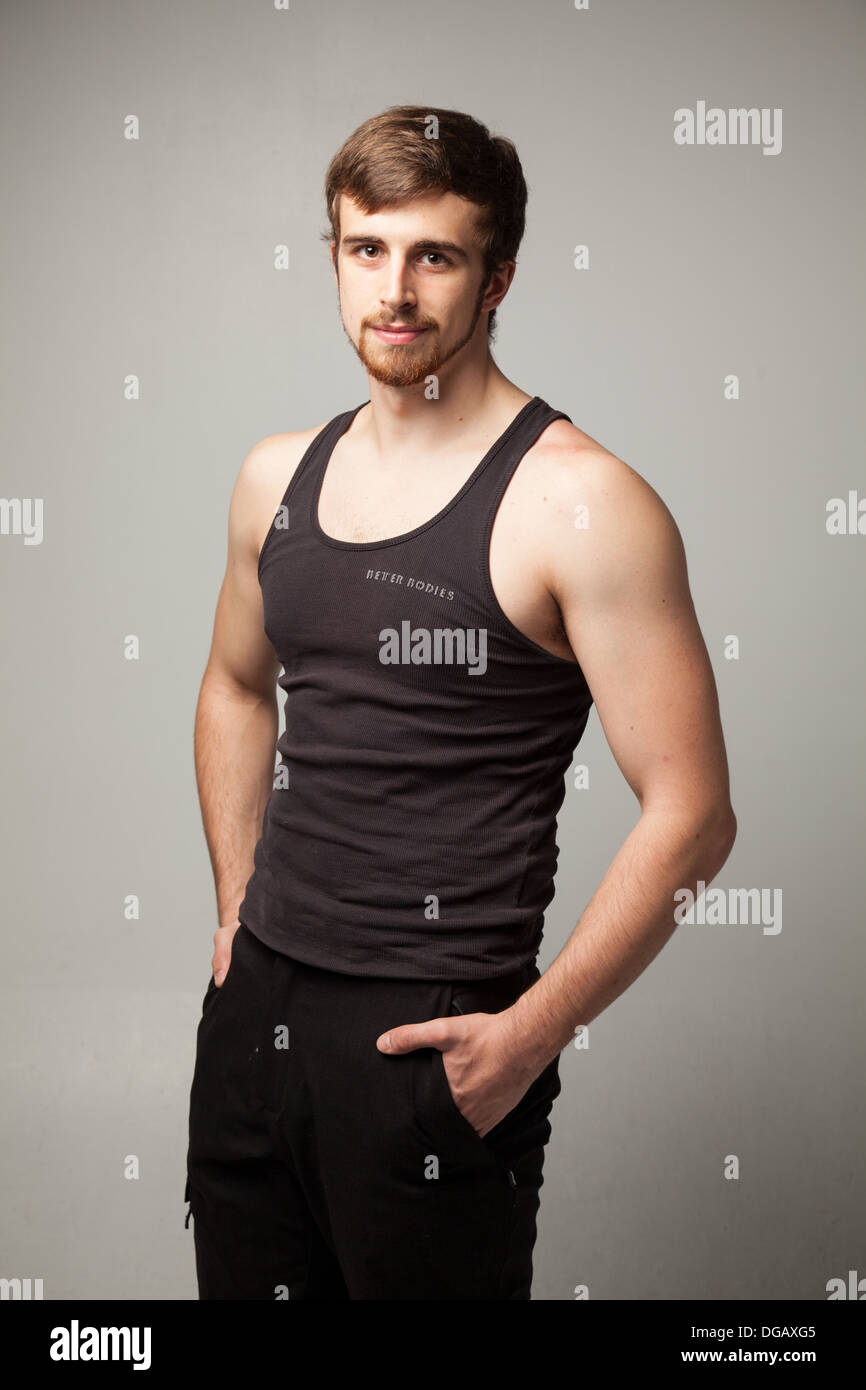 Athletic young male model in T-shirt Stock Photo - Alamy