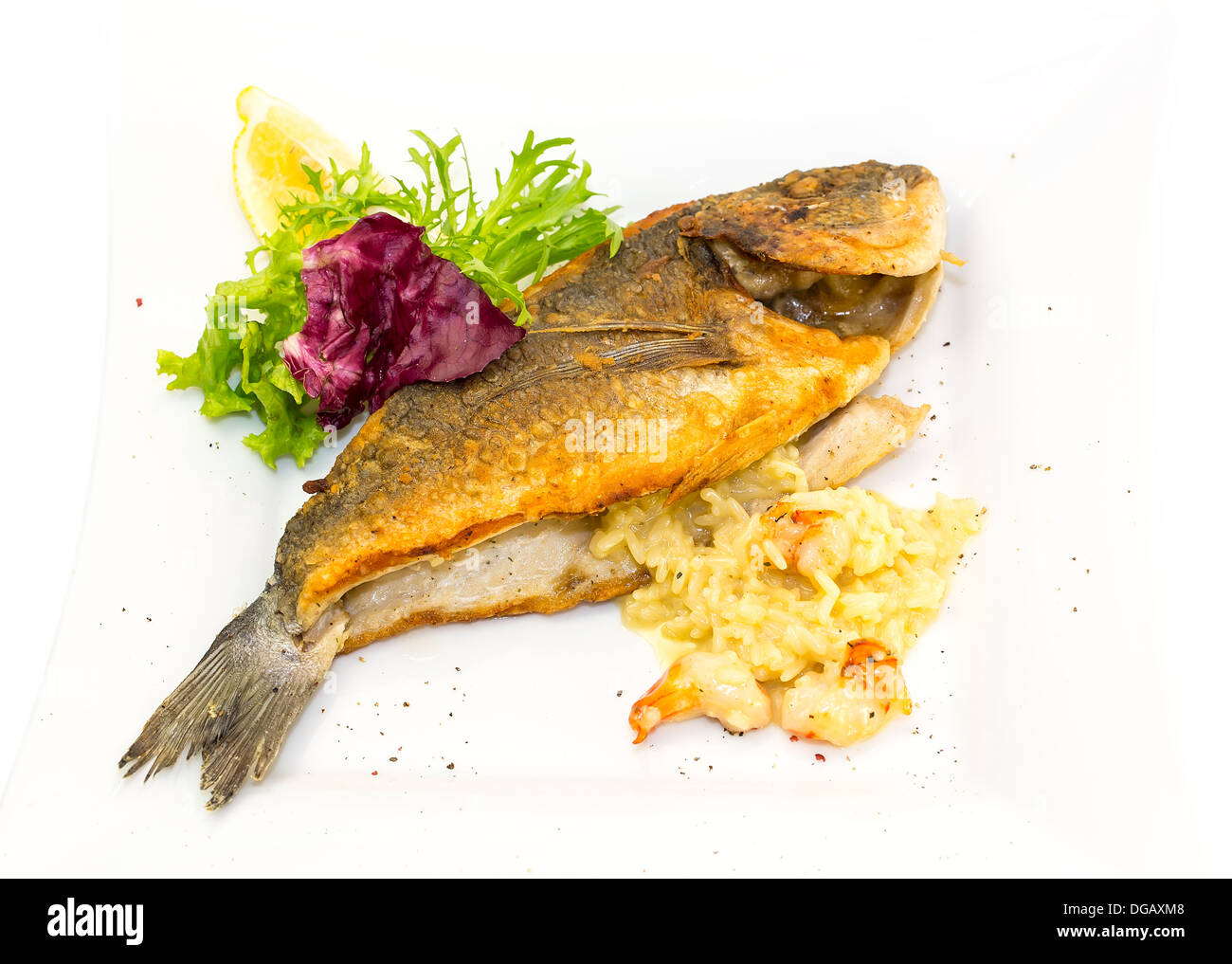Plate baked dorado fish Cut Out Stock Images & Pictures - Alamy