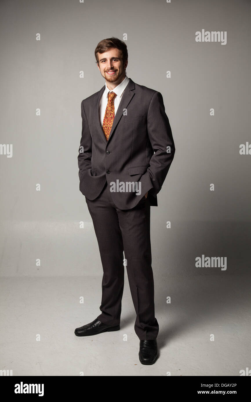 Handsome young male executive type model full length Stock Photo - Alamy