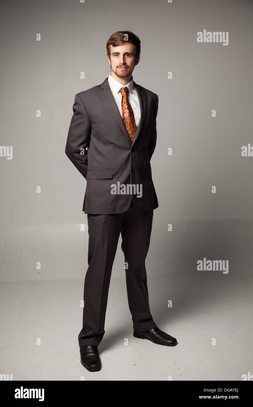 Handsome young male executive type model full length Stock Photo - Alamy