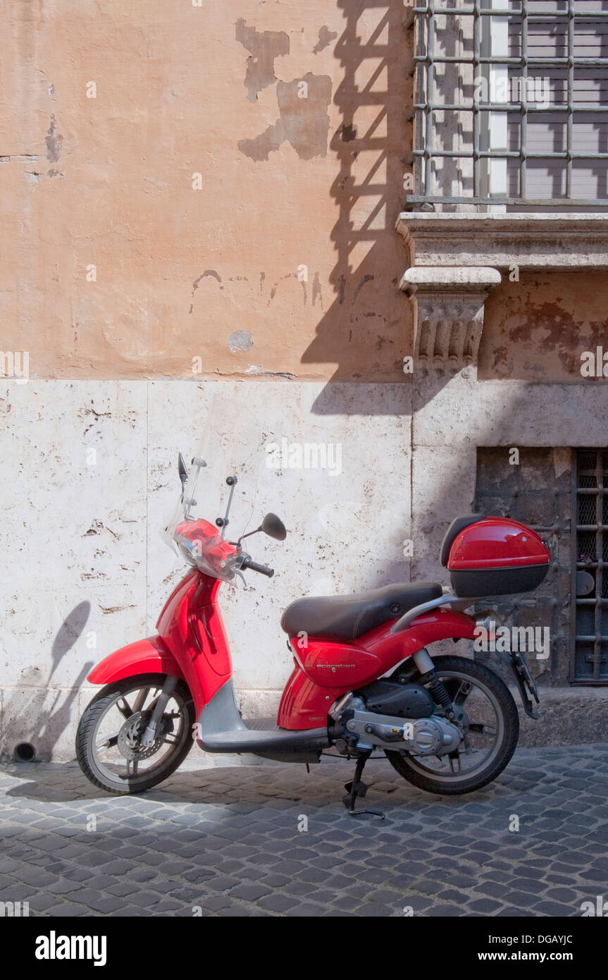 A red vespa in central Rome Italy Stock Photo - Alamy