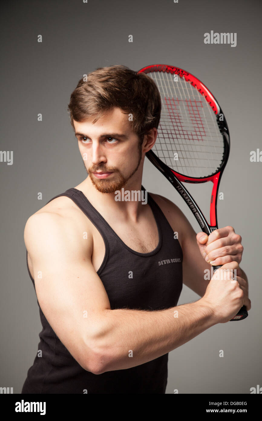 Fit male tennis player model Stock Photo - Alamy