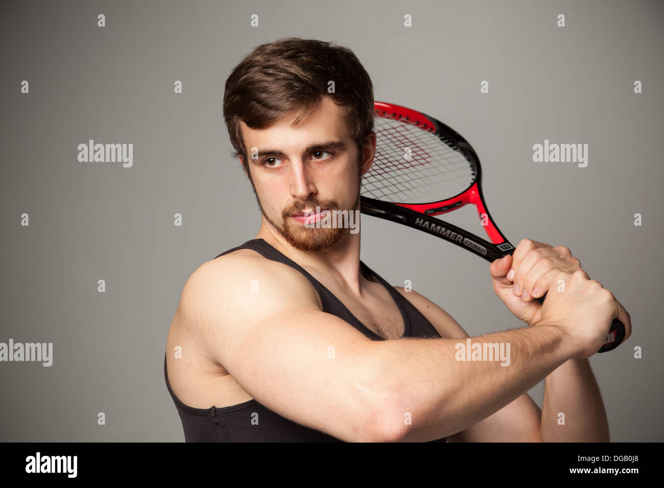 Fit male tennis player model Stock Photo - Alamy