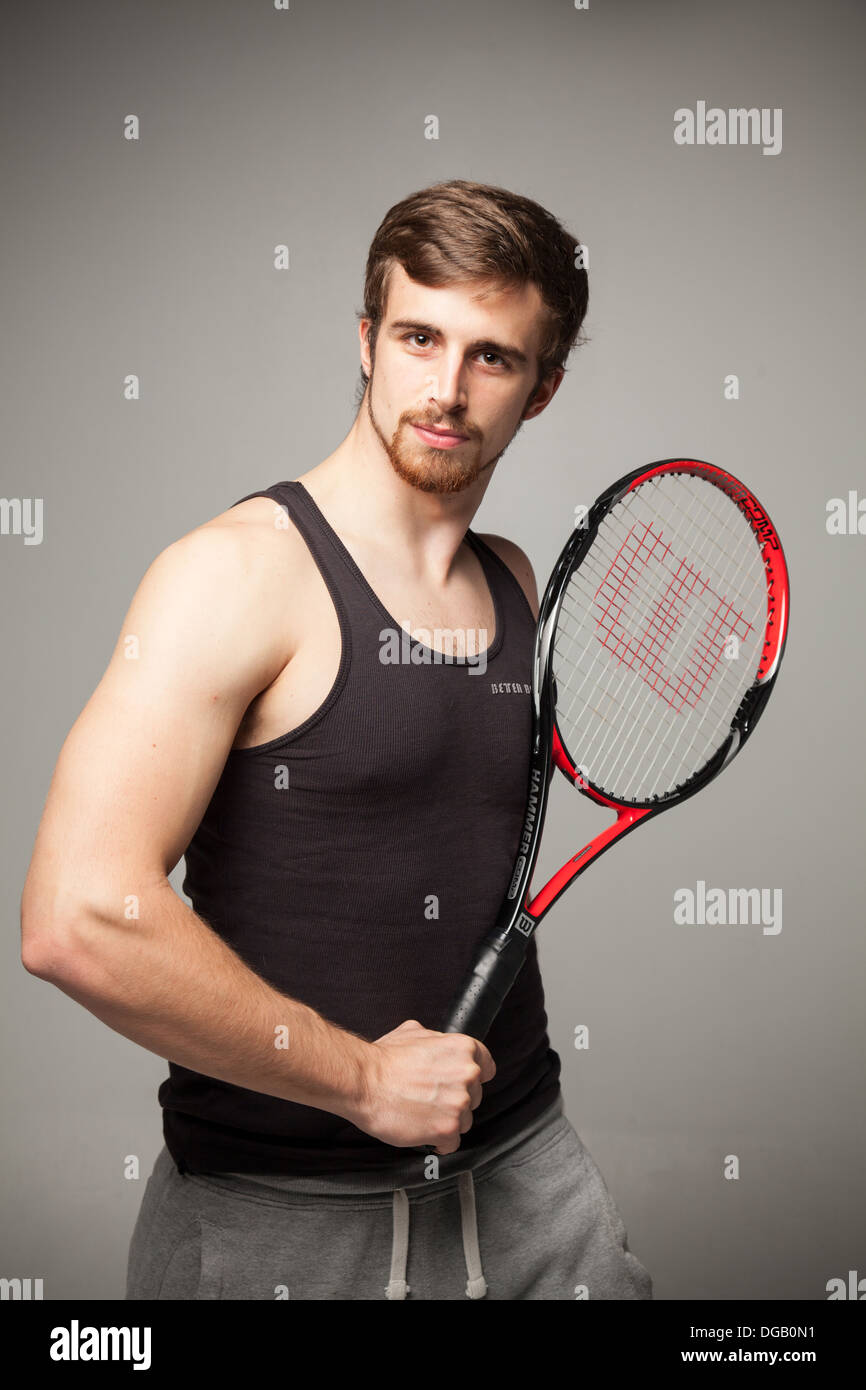 Fit male tennis player model Stock Photo - Alamy