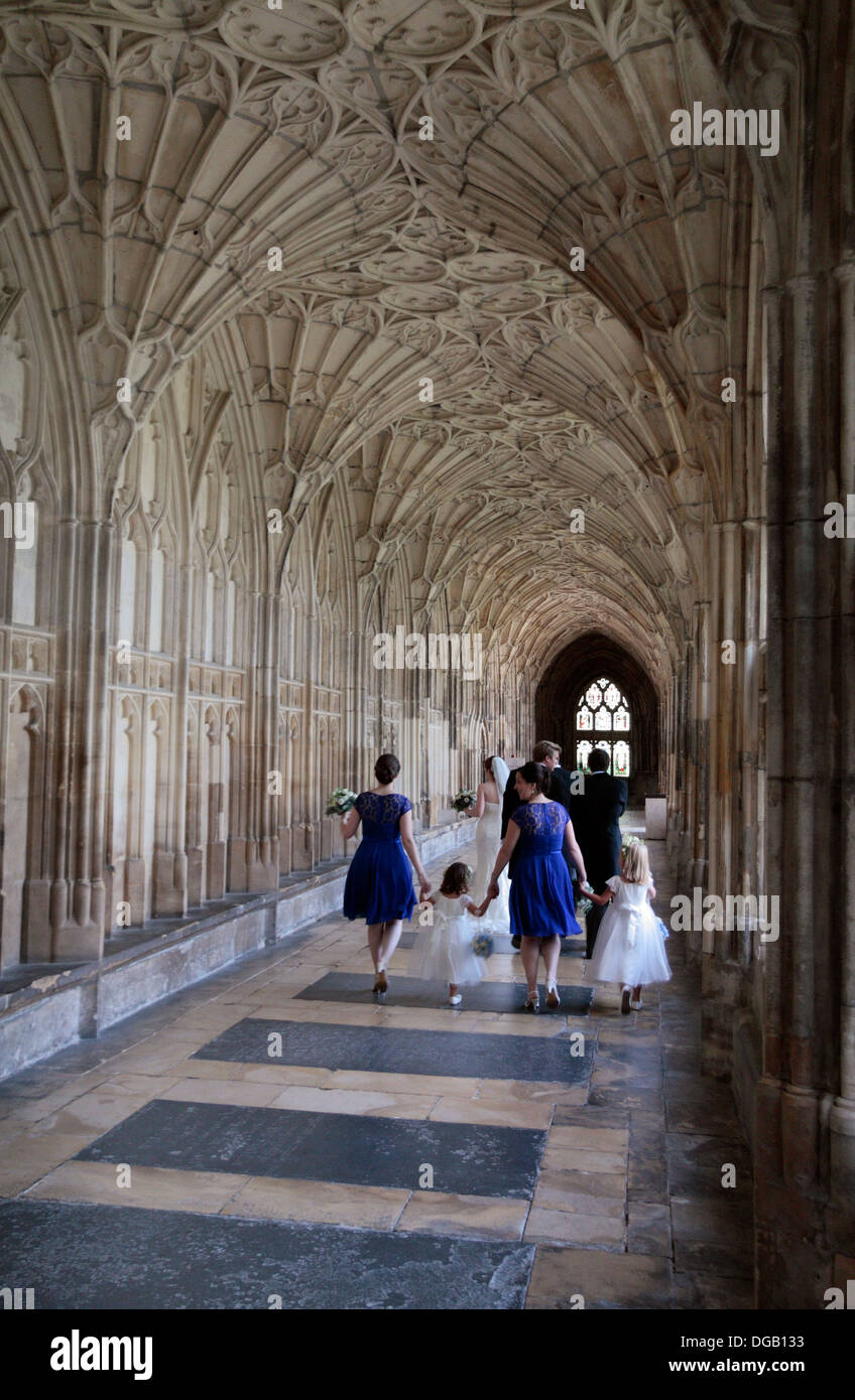 Bridal group passing through the Cloisters in Gloucester Cathedral ...