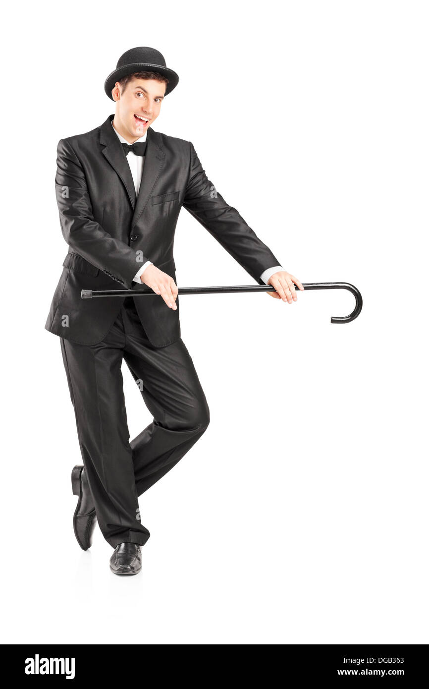 Full length portrait of a male magician holding a cane Stock Photo - Alamy