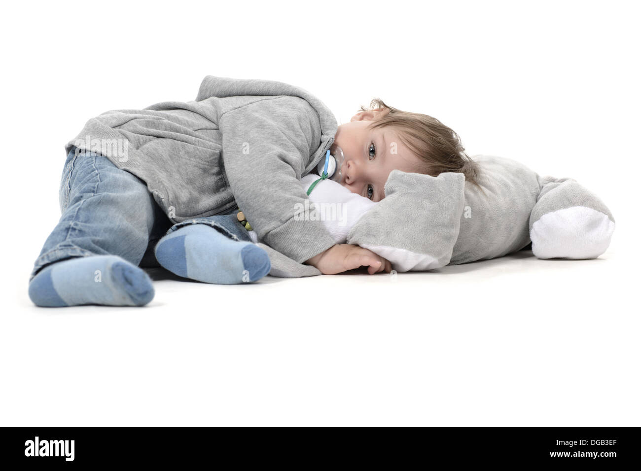 Sleepy kid with cuddle animal Stock Photo - Alamy