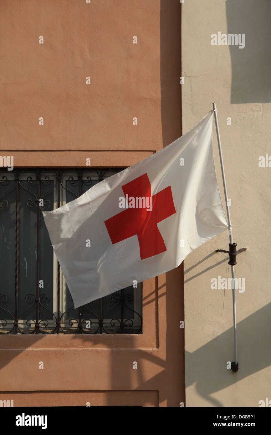 red cross flag outside building in rome italy Stock Photo - Alamy
