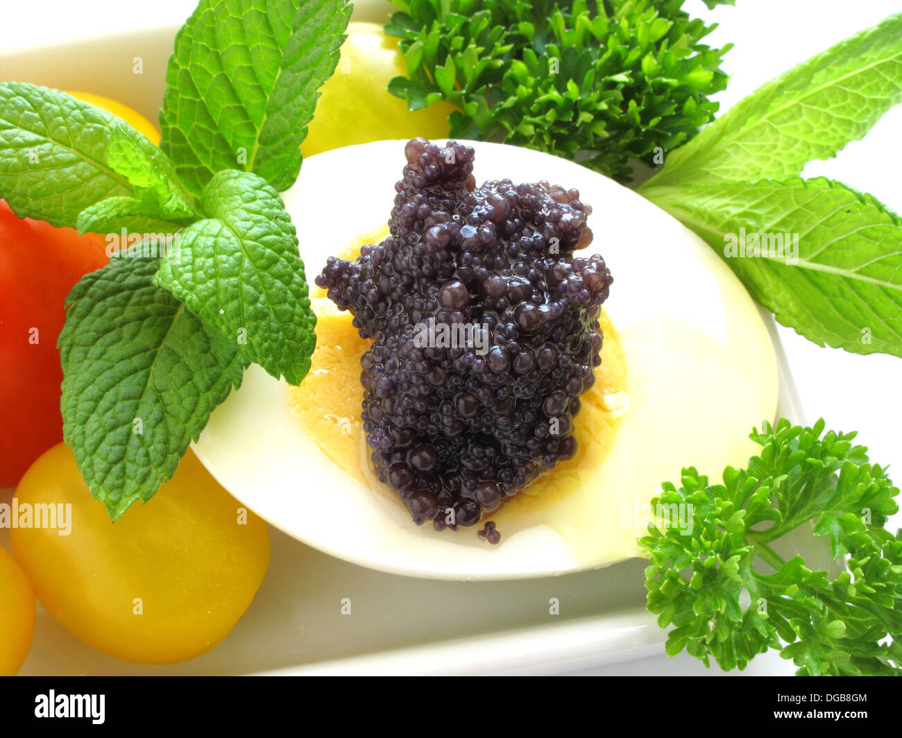 Boiled egg, Lumpfish roe, tomatoes and mint Stock Photo - Alamy