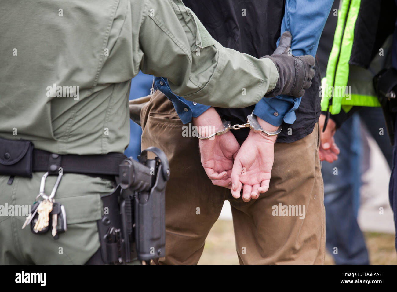 Arresting man handcuffs hi-res stock photography and images - Alamy