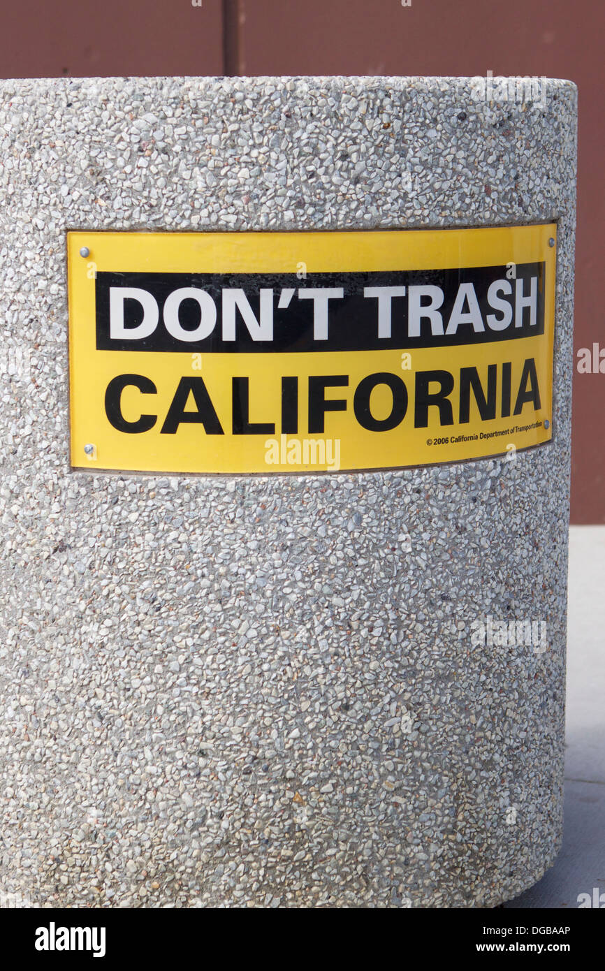 A concrete trash can in California with a sign saying don't trash ...