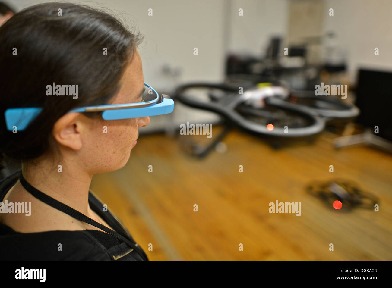 Controlling an AR Drone toy drone using Google glasses at a Nodecopter, an event where people ...