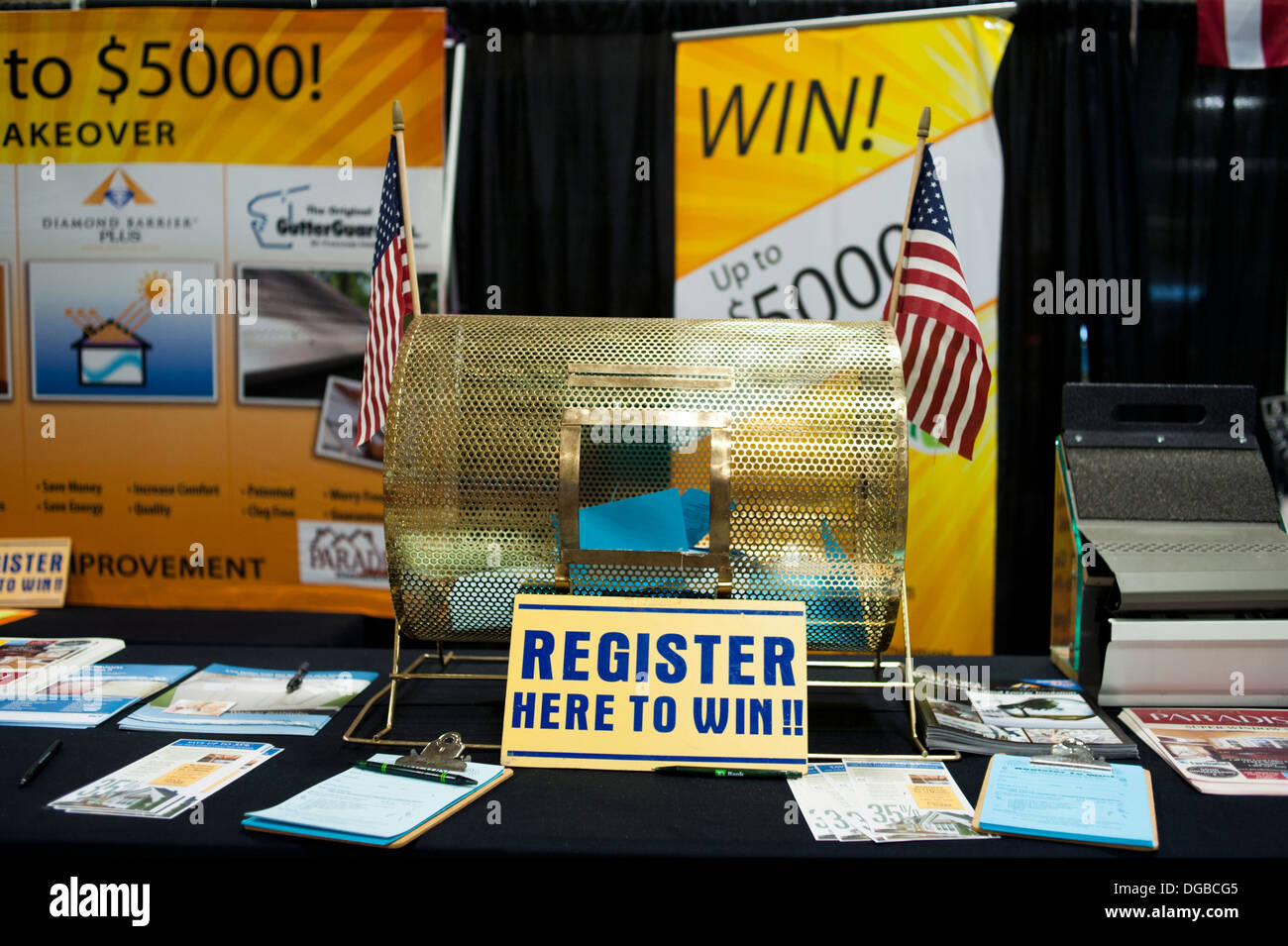 A raffle ticket spinner cage on sales table Stock Photo - Alamy