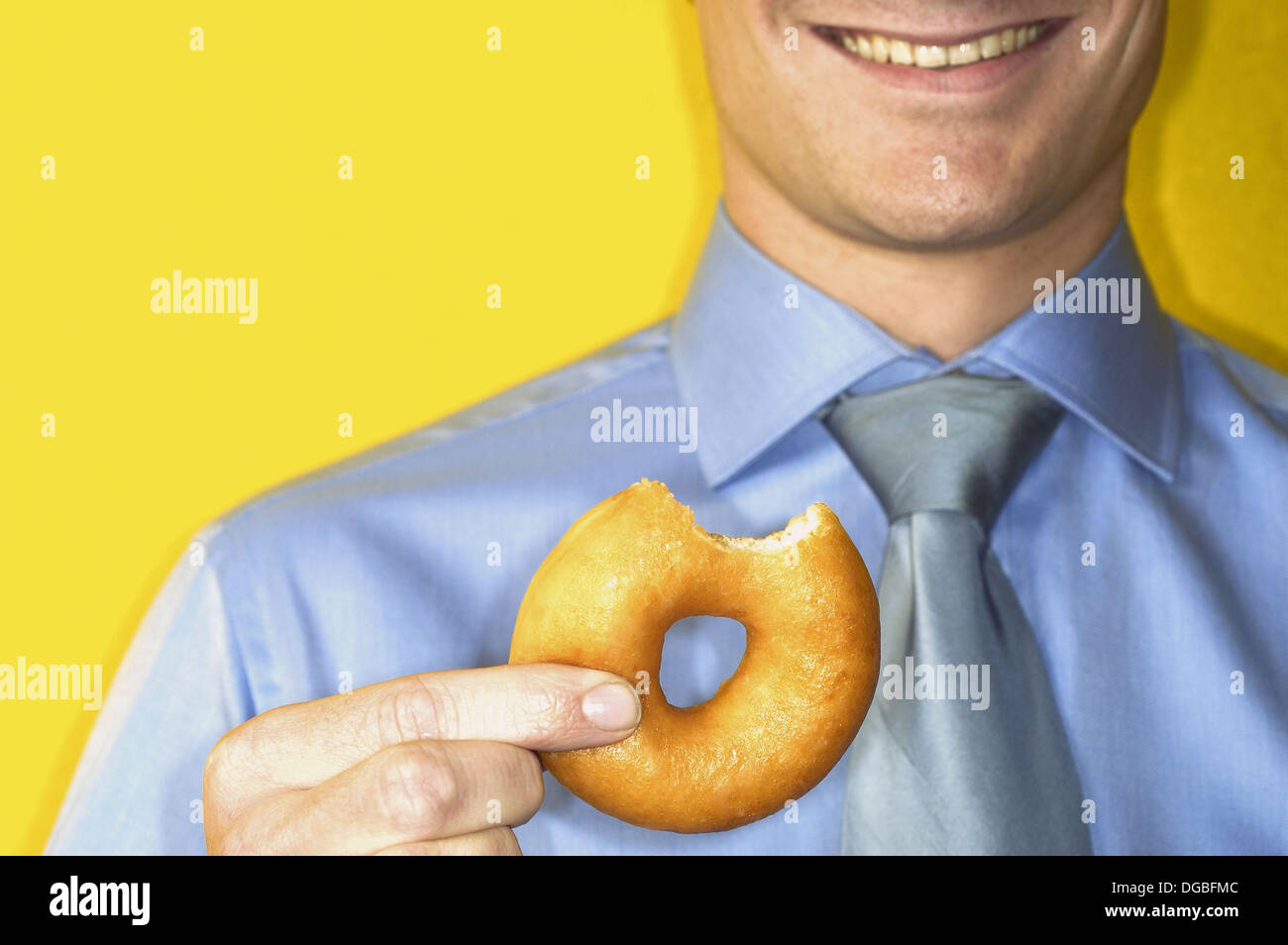 Man biting doughnut hi-res stock photography and images - Alamy