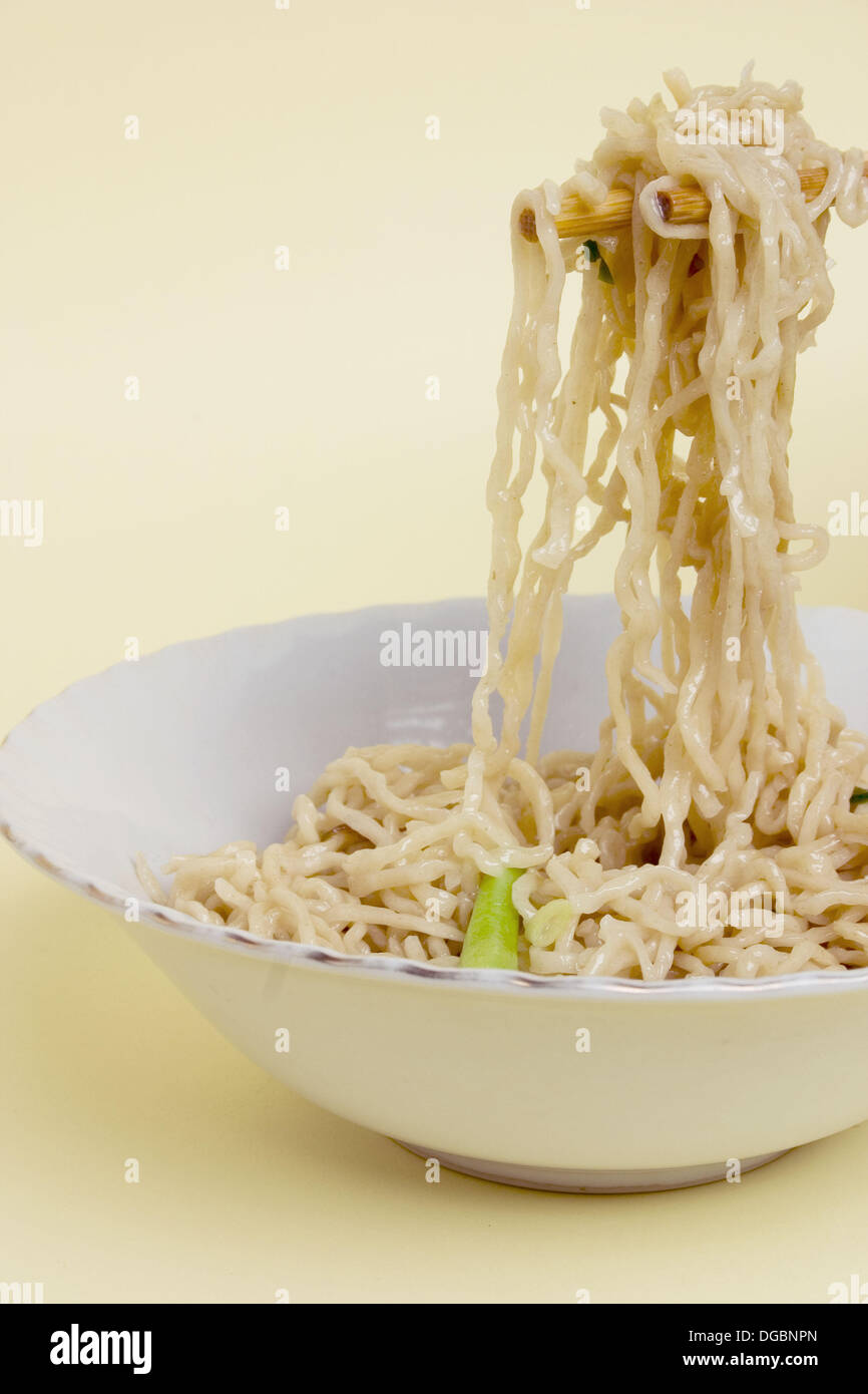 Chinese noodles hold on chop sticks Stock Photo - Alamy