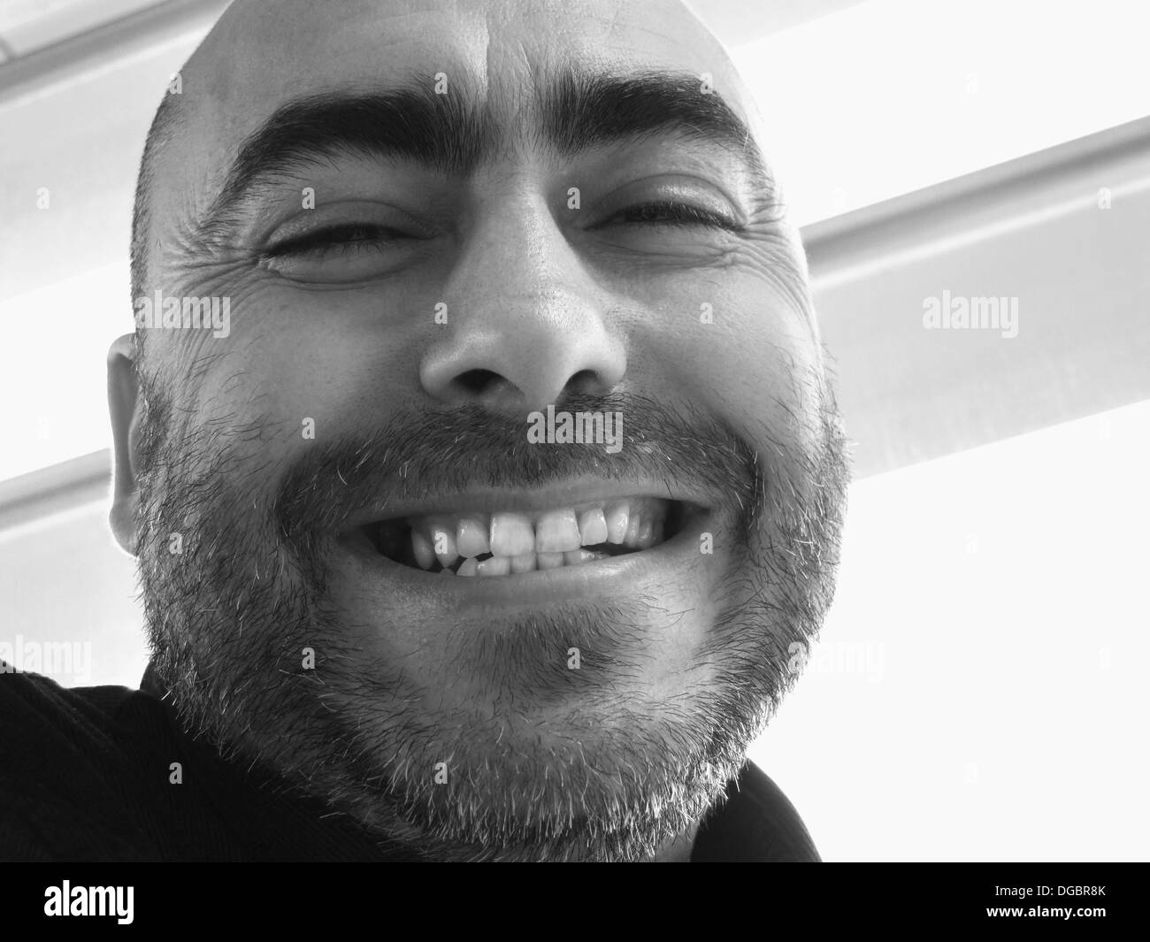 Smiling middle aged looking up Black and White Stock Photos & Images ...