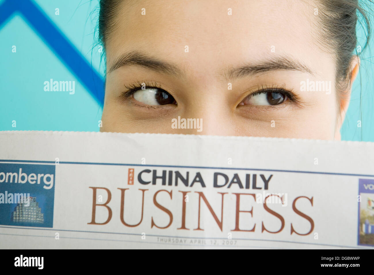 Young woman covering face newspaper hi-res stock photography and images ...