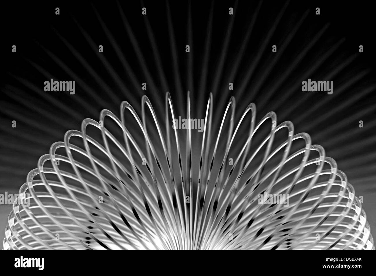 Starburst of a Slinky spring, In black and white Stock Photo - Alamy