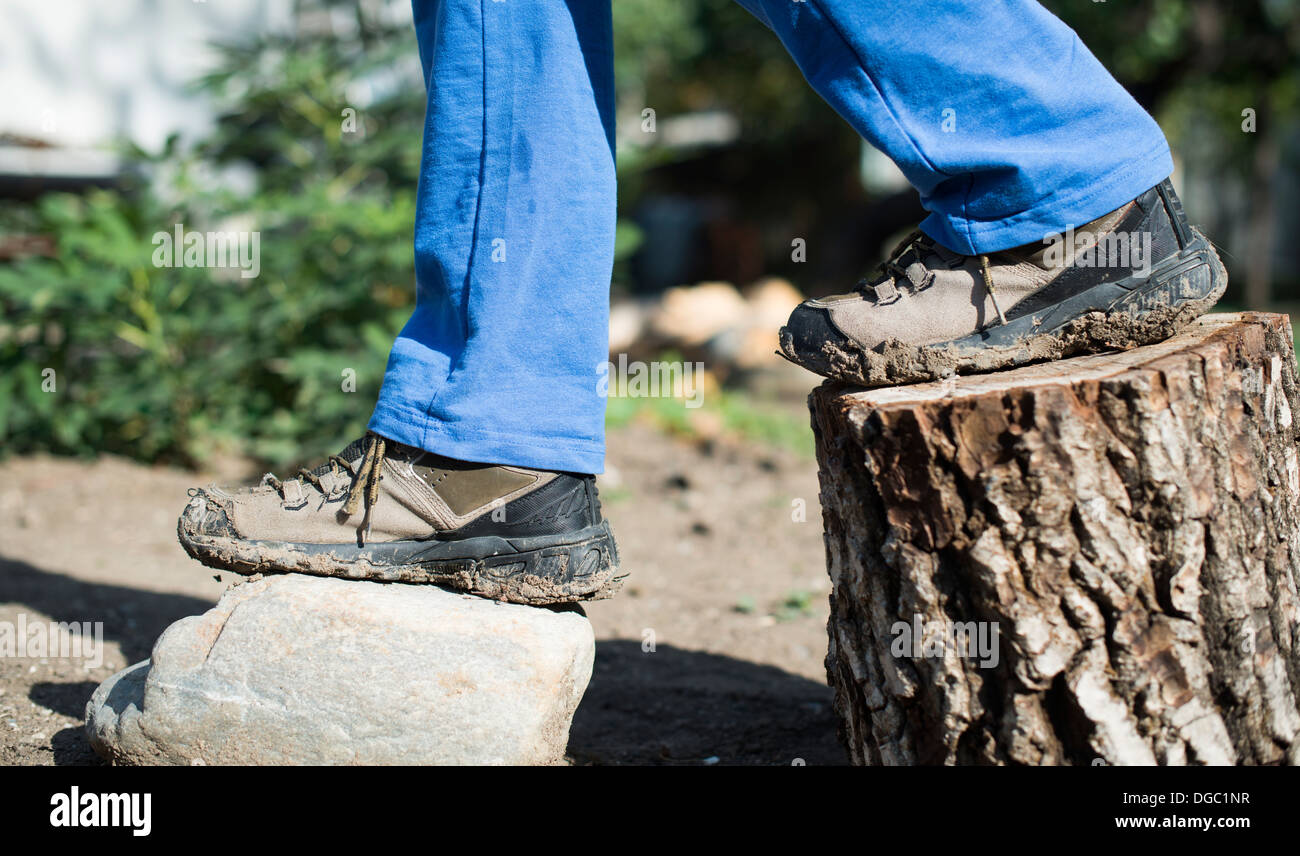 Brown hiking shoes on a stump in the forest Stock Photo - Alamy