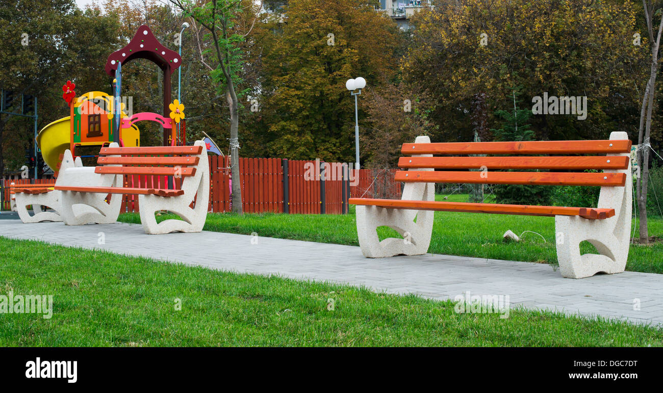 New wooden benches in a park Stock Photo - Alamy