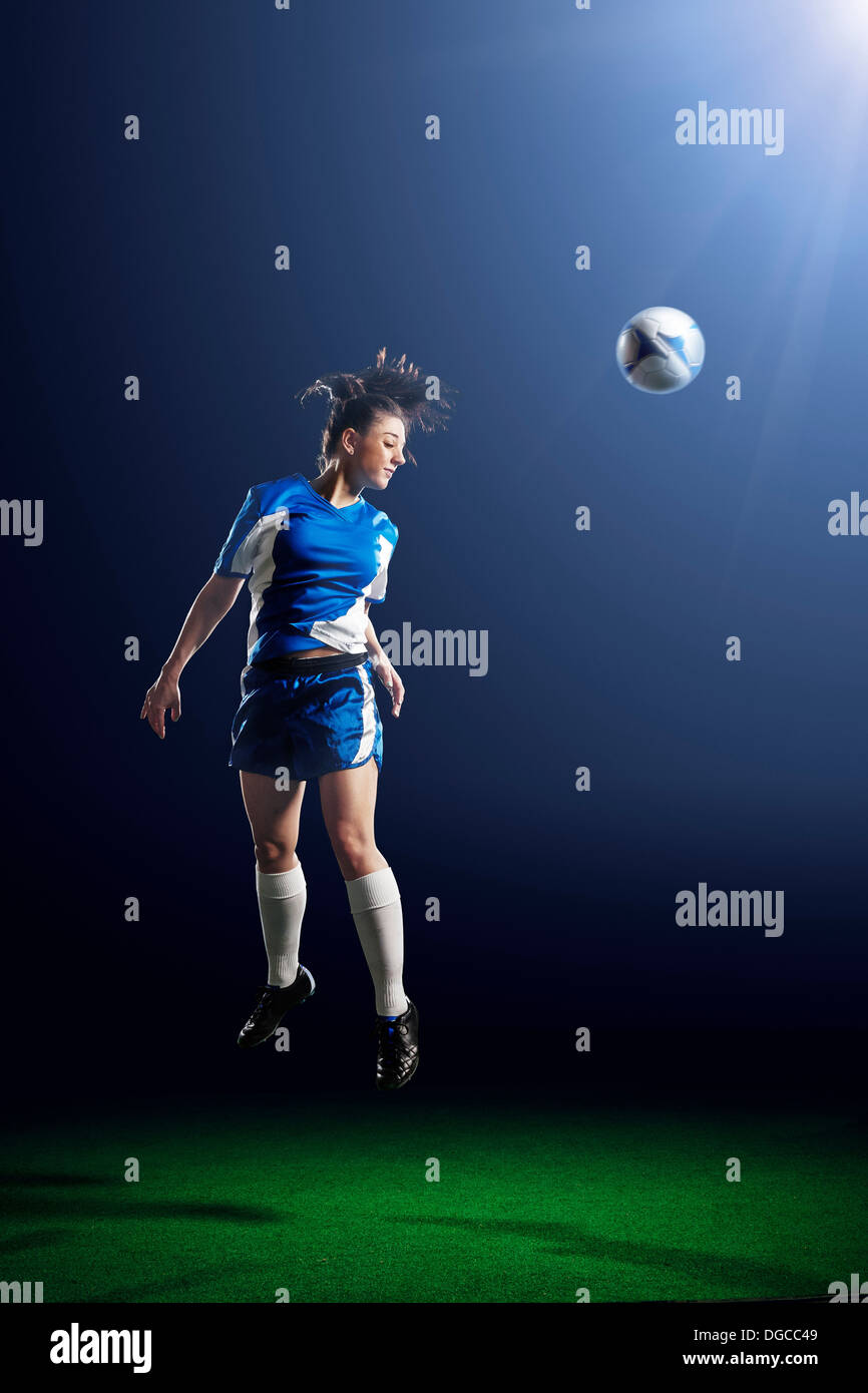 Football player heading ball hi-res stock photography and images - Alamy