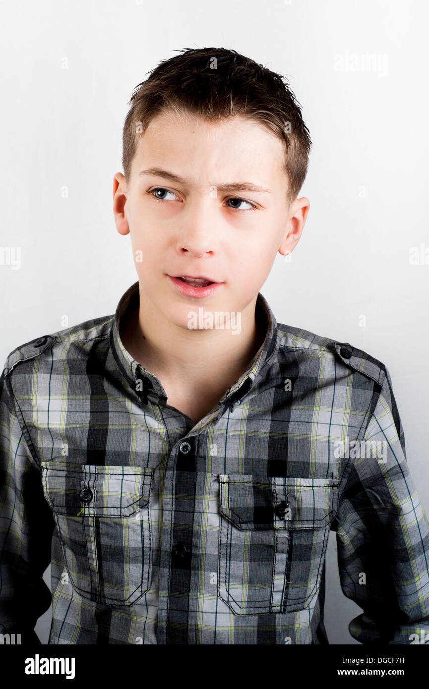 teenage boy looking puzzled Stock Photo - Alamy