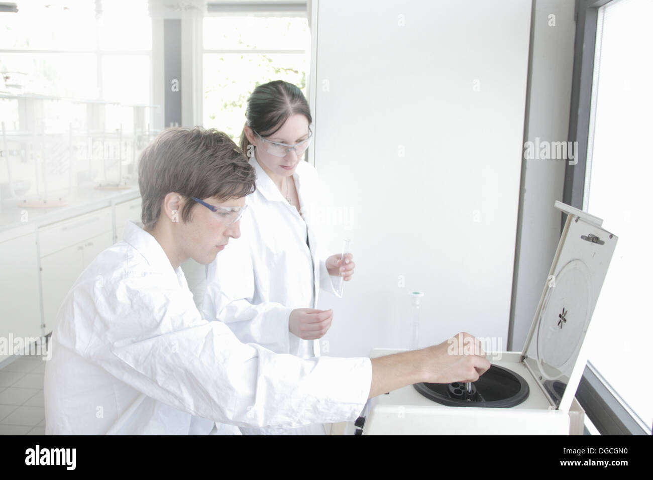 Chemistry students using equipment in laboratory Stock Photo - Alamy