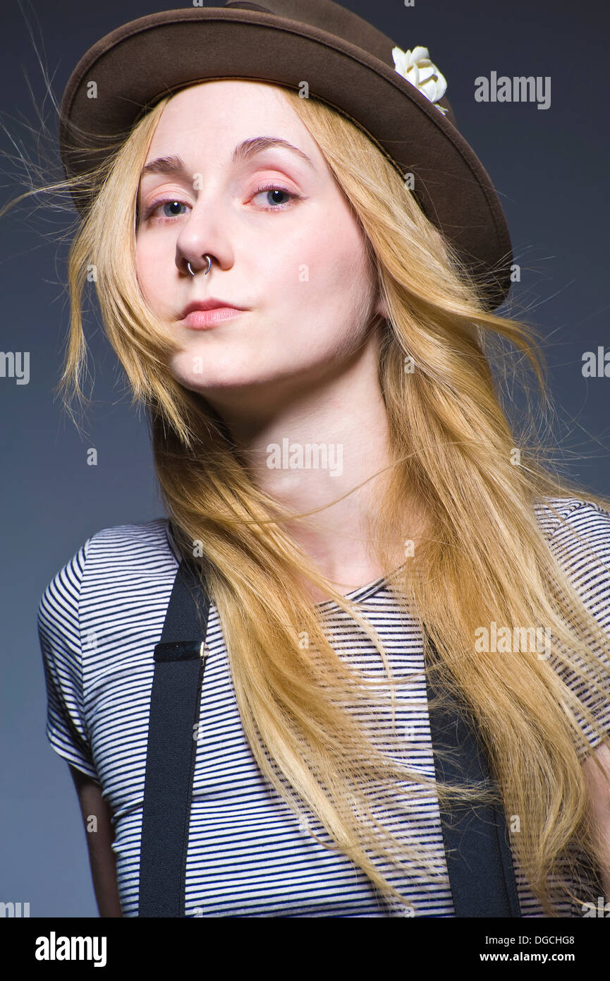 Mid adult woman wearing hat in studio, portrait Stock Photo - Alamy