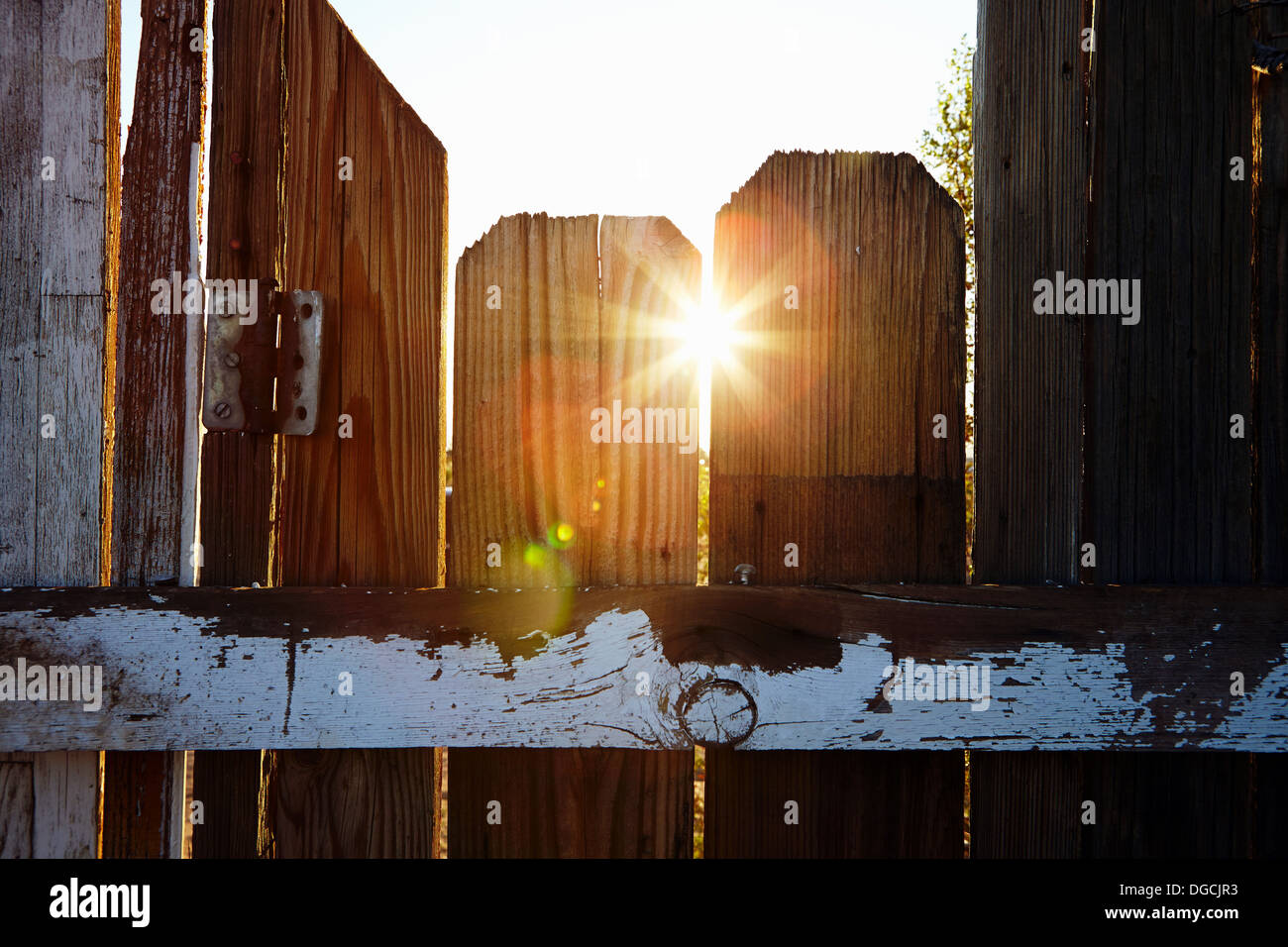 Sunlight through wooden fence Stock Photo - Alamy