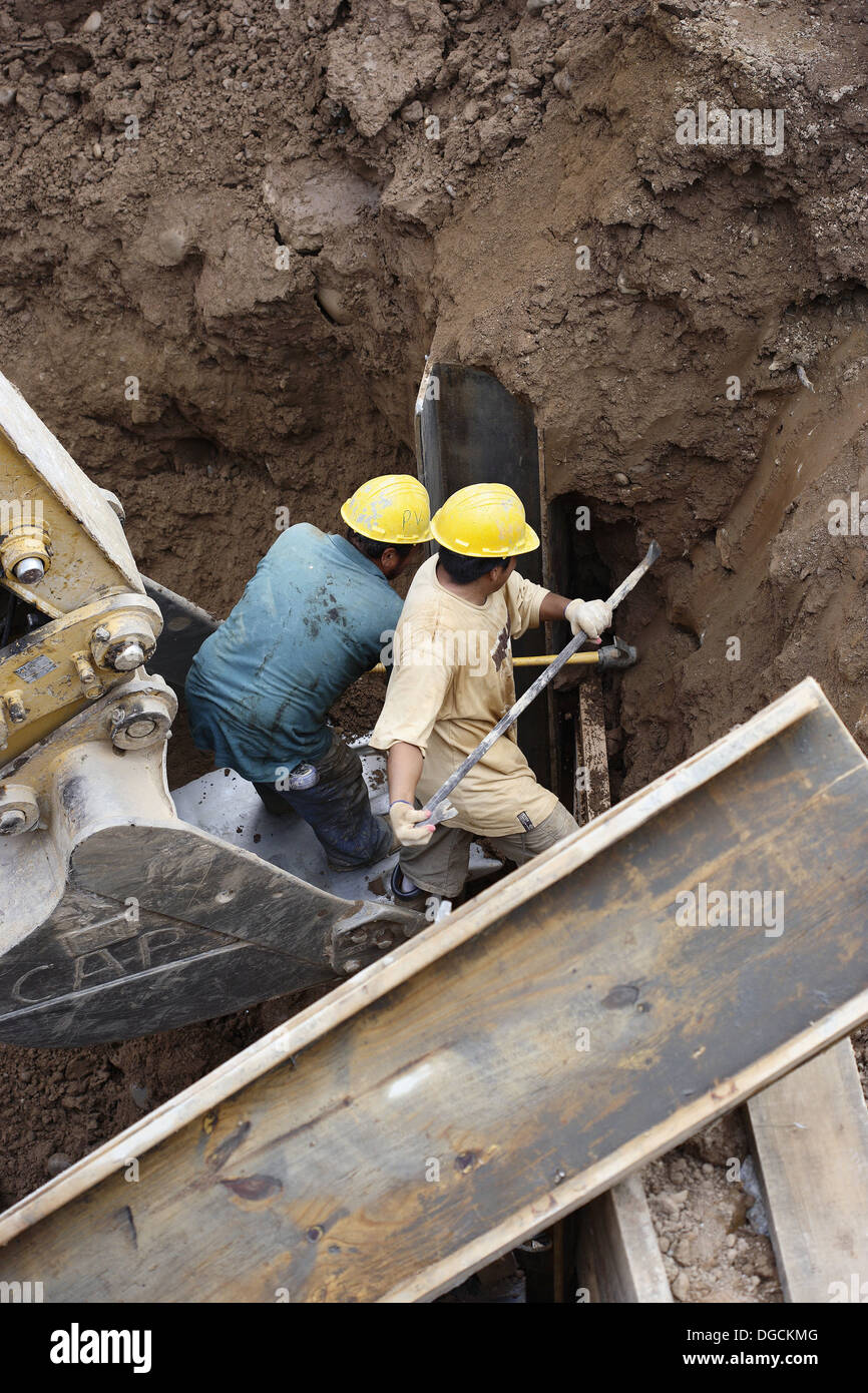 Construction workers digging out foundation hi-res stock photography ...