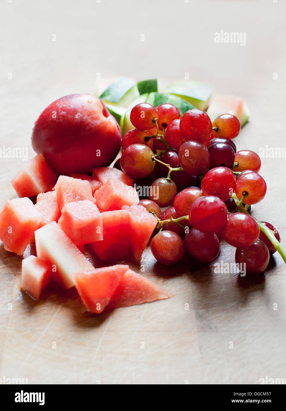 Watermelon slices, red grape and peach, close up Stock Photo - Alamy
