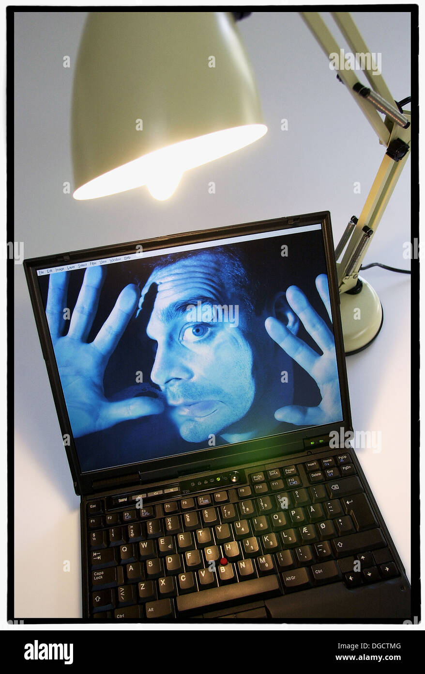 Man caught in computer Stock Photo - Alamy
