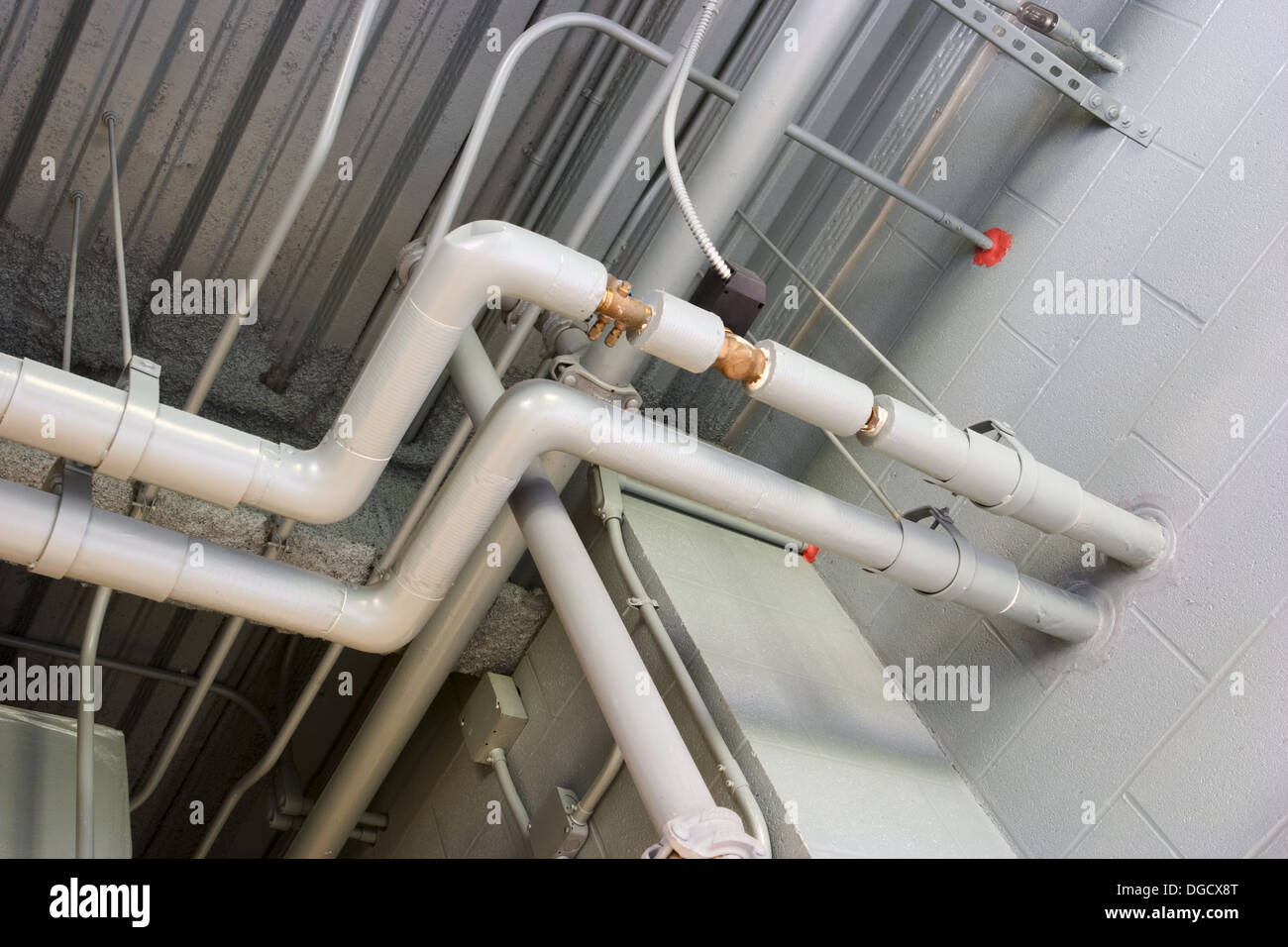 Overhead pipes and wiring in a university science building Stock Photo ...