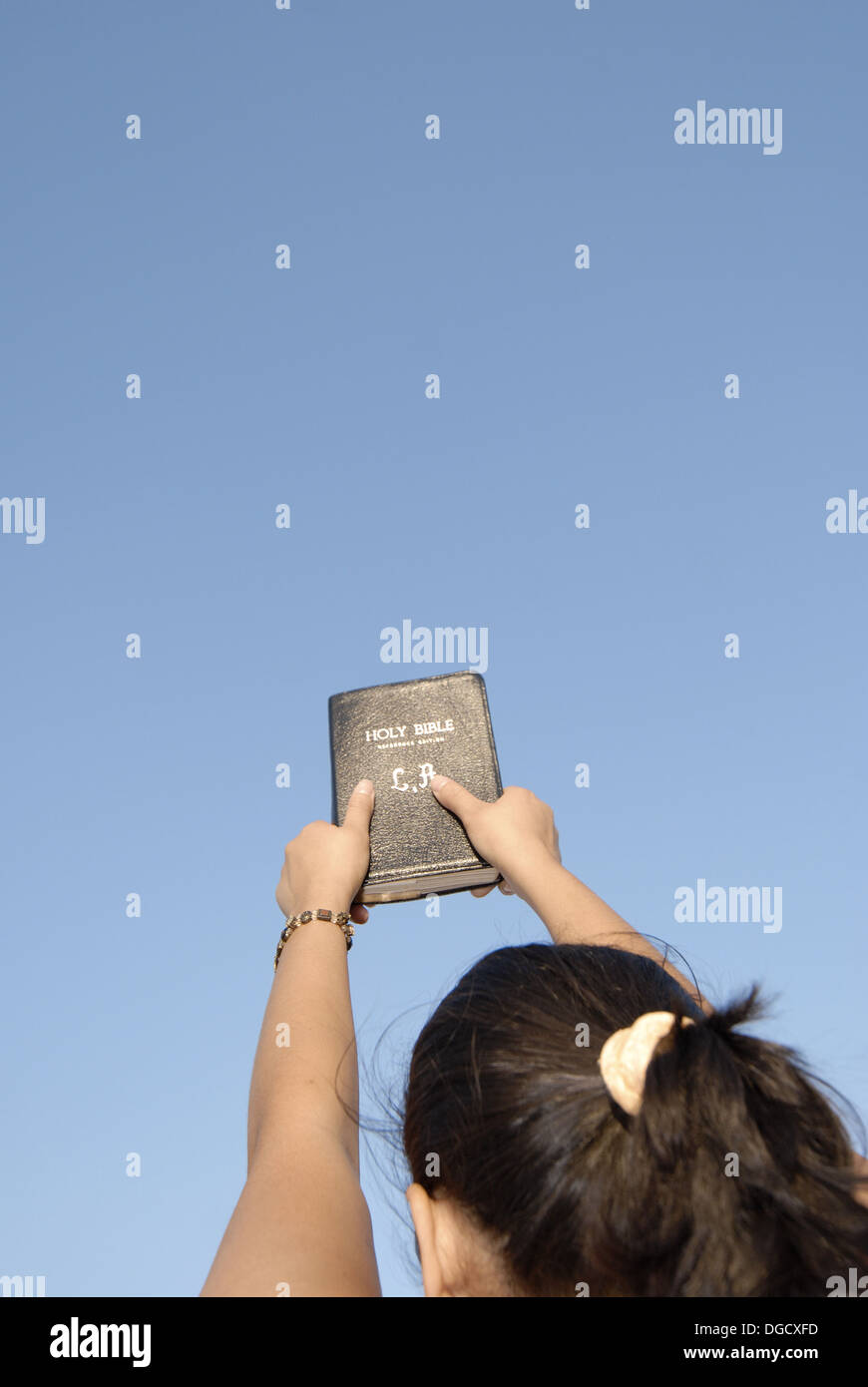 Woman holding bible hi-res stock photography and images - Alamy