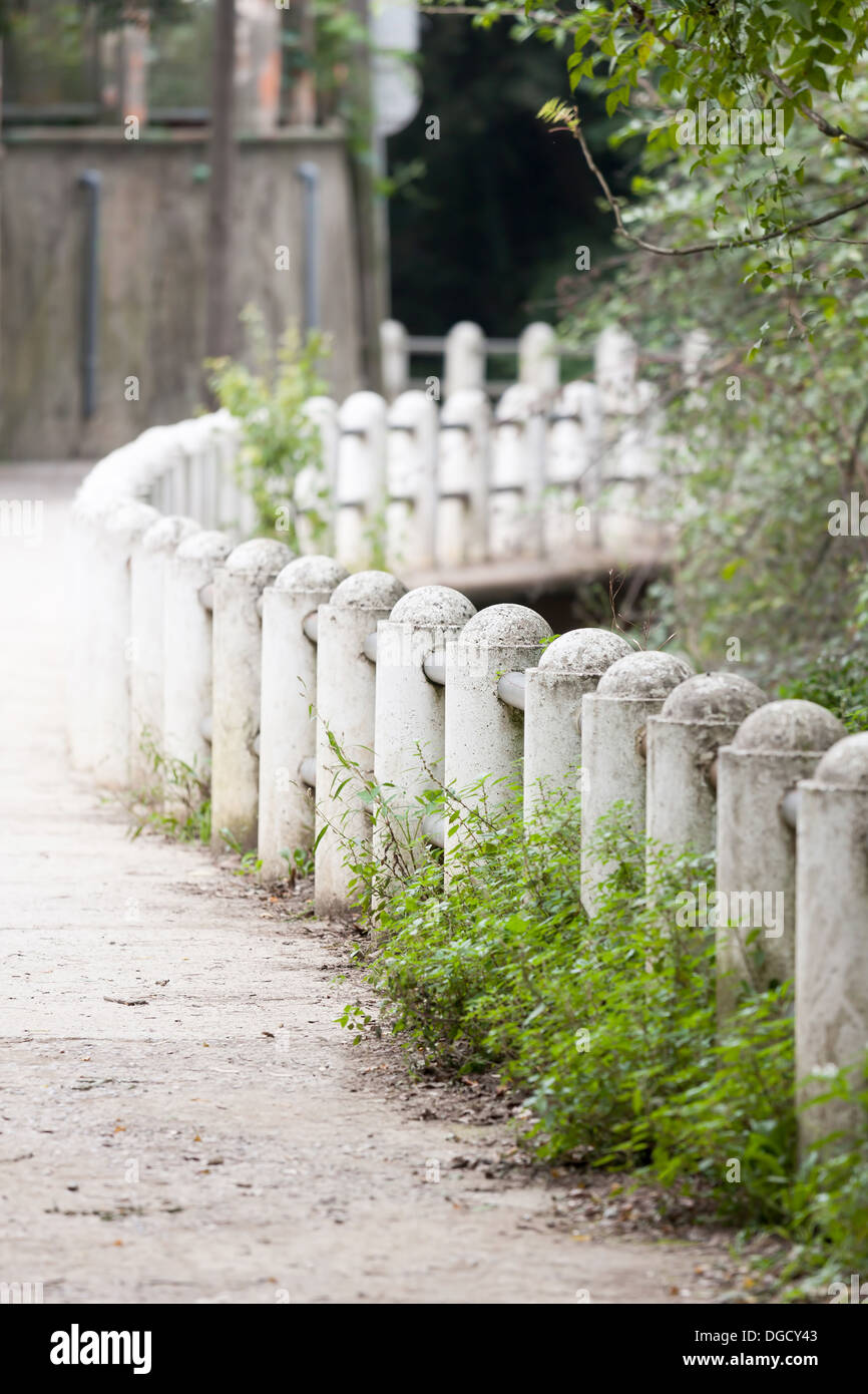 Beautiful arched concrete fence outdoors Stock Photo - Alamy