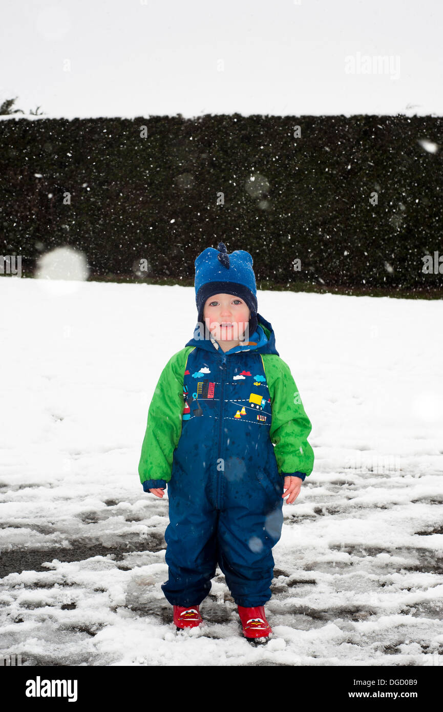 Small boy in snow blizzard Stock Photo - Alamy