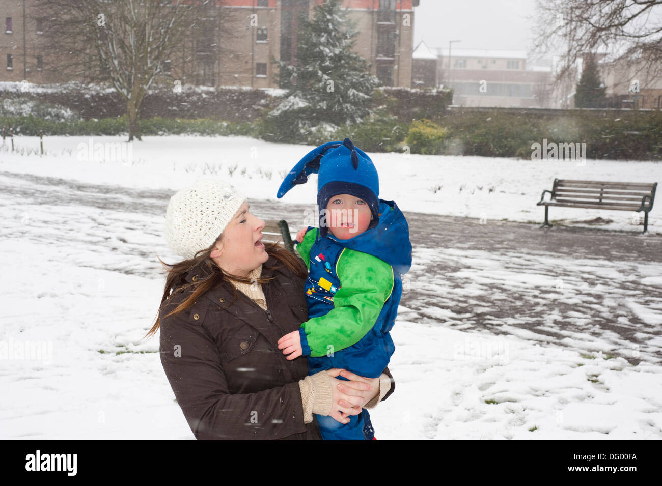 Mum and son in snow blizzard Stock Photo - Alamy