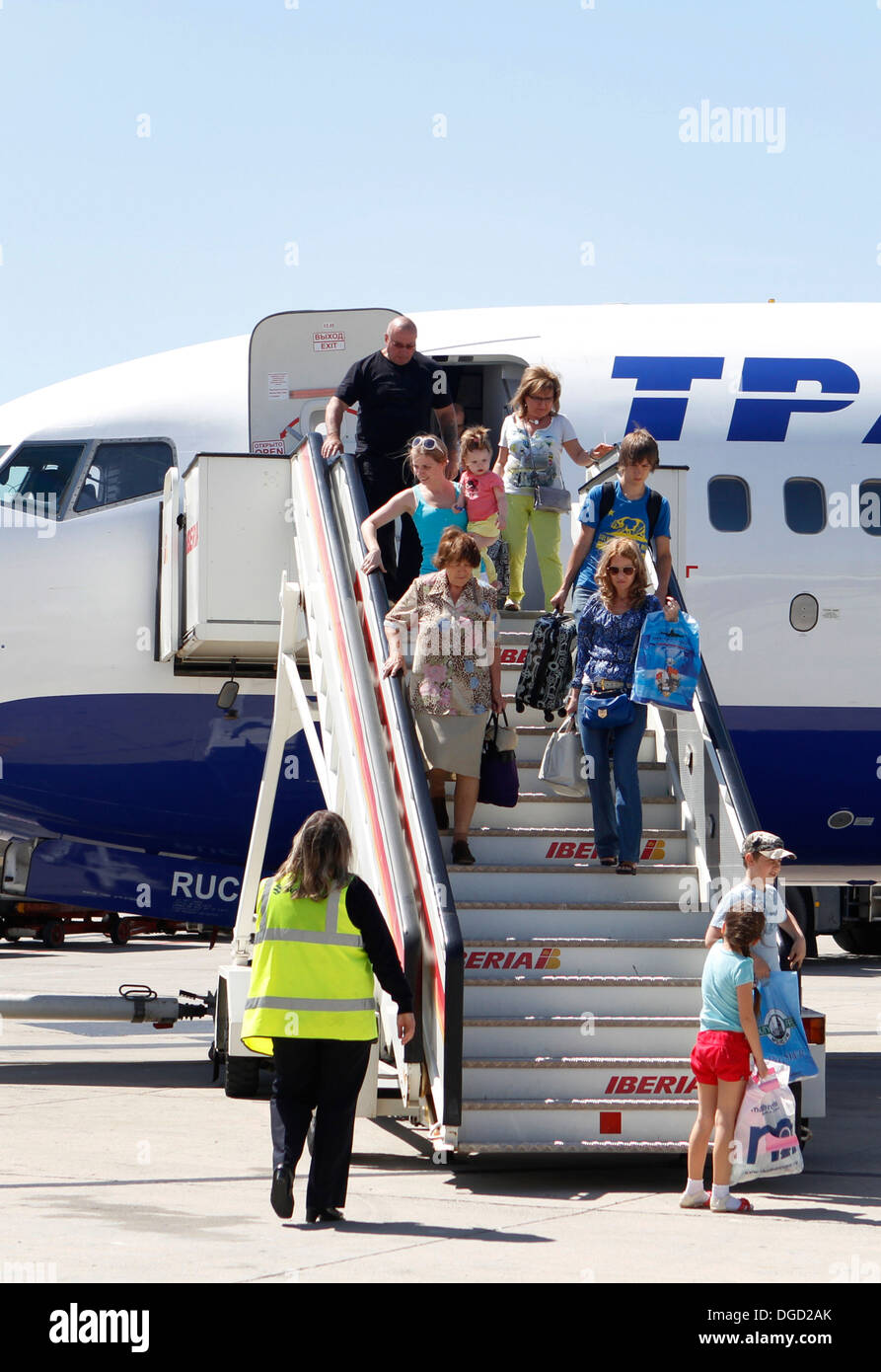 Passengers from plane carrying hi-res stock photography and images - Alamy