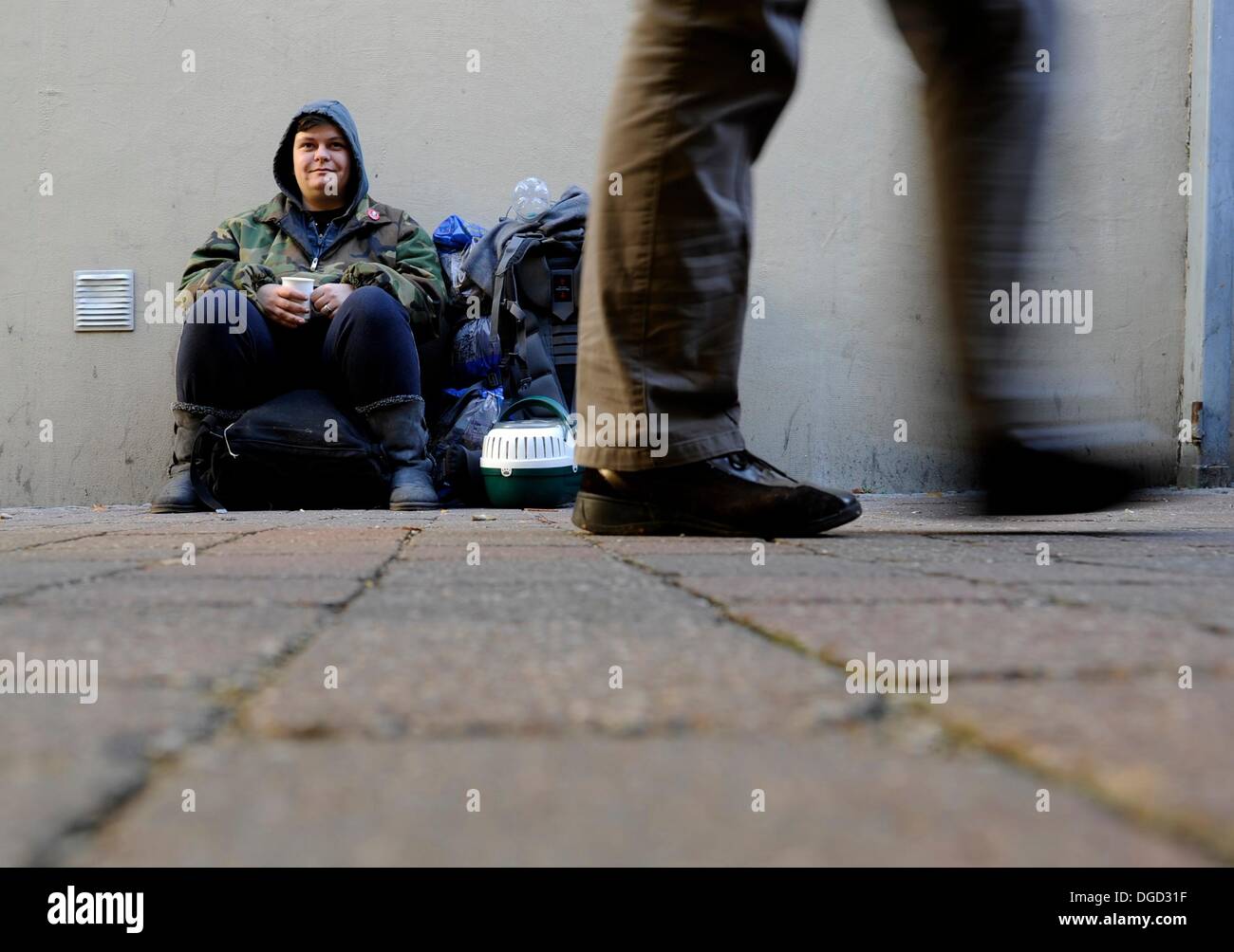 Hamburg, Germany. 18th Oct, 2013. 26-year-old homeless Anica sits with ...